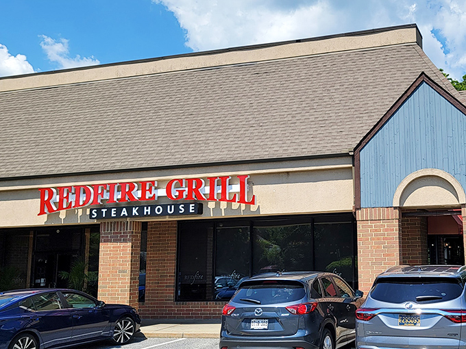 Redfire Grill's bold sign promises what awaits inside: steaks that make you forget your own name.