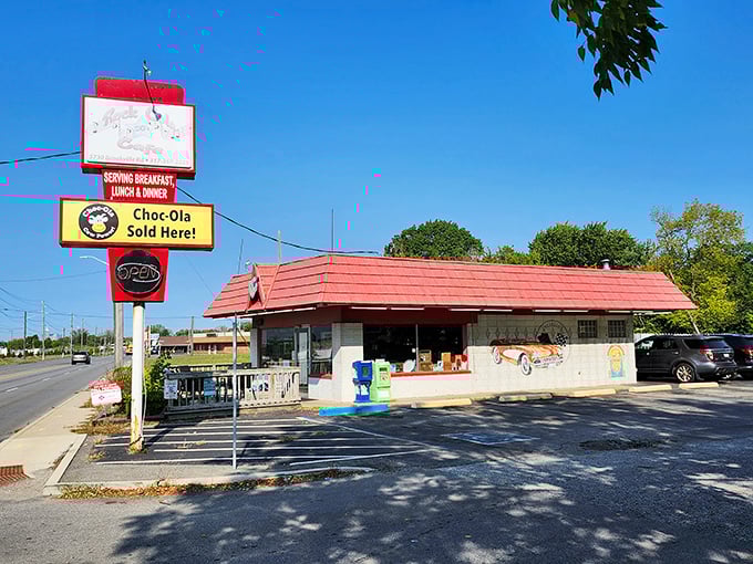 That classic red roof and "Choc-Ola Sold Here!" sign? Pure nostalgic magic that promises comfort food and a trip back in time.