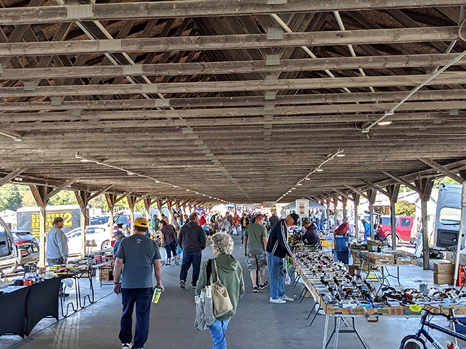 Bargain hunters paradise! The wooden pavilion at Rogers Flea Market shelters treasure seekers from Ohio's unpredictable weather while they hunt for deals.