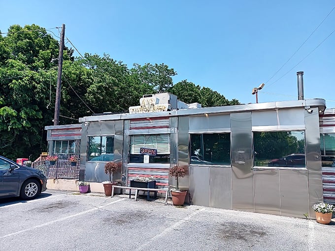 The Route 30 Diner gleams like a time machine with wheels, its silver exterior promising comfort food that grandma would approve of.