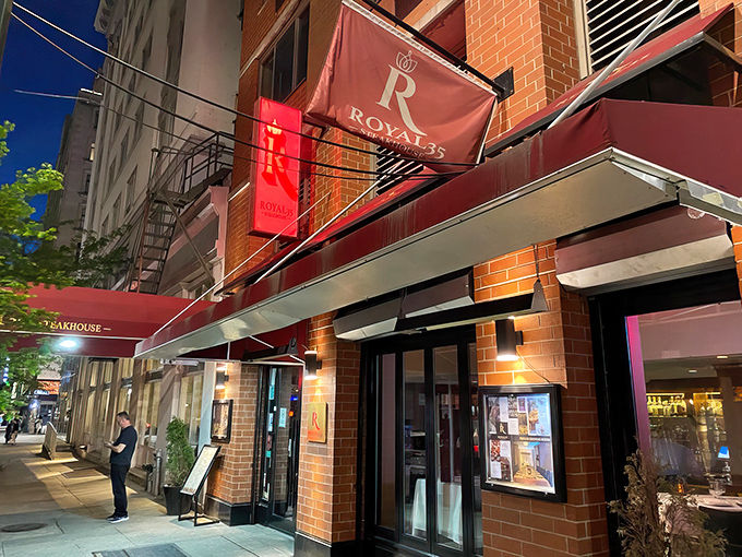 Royal 35's elegant red awning beckons like a matador's cape, promising a carnivorous adventure within these brick walls.