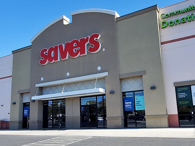 The bright red Savers sign beckons like a lighthouse for bargain hunters. This treasure trove awaits with aisles of possibilities!