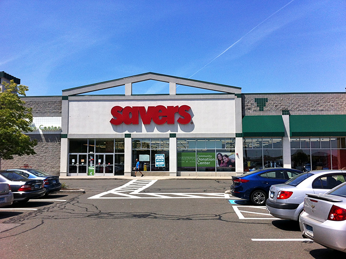 The bright red Savers sign beckons like a lighthouse to treasure hunters navigating the sea of retail options.