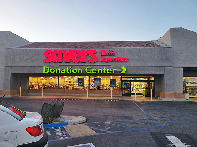 The bright red Savers sign beckons like a lighthouse to bargain hunters navigating the sea of retail prices.