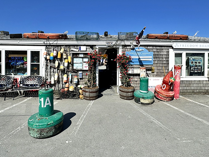Weathered shingles and colorful buoys create the perfect seaside charm that screams "authentic New England seafood."
