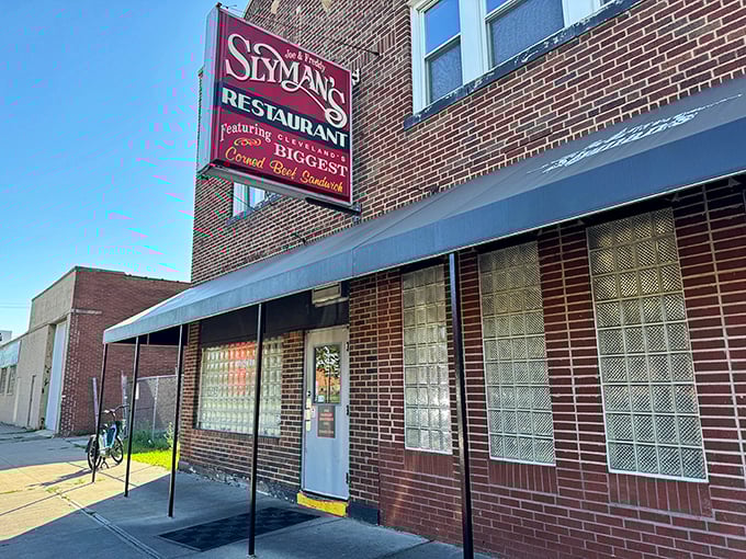 The brick facade of Slyman's promises what lies within—a sandwich experience that requires both hands and possibly a forklift.
