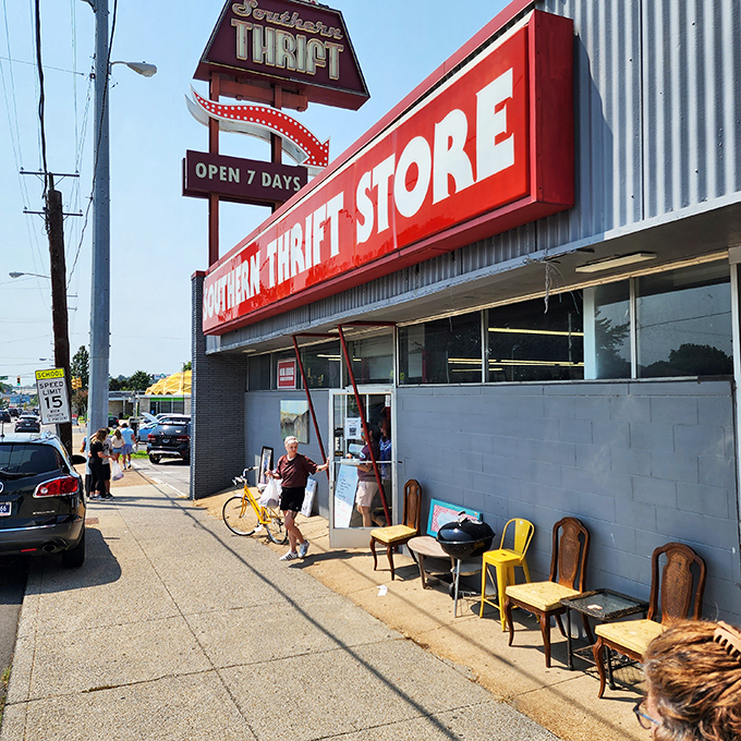 Southern Thrift's iconic red sign beckons bargain hunters like a lighthouse for the frugally fashionable. The sidewalk preview of chairs is just a taste of treasures within.