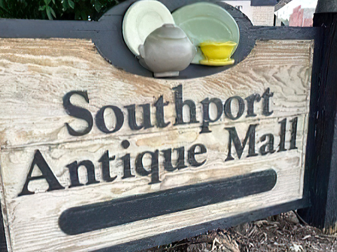 That rustic wooden sign promises treasures inside - like a roadside beacon for vintage souls.