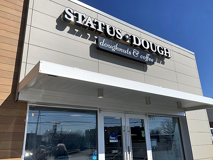 Status Dough's modern storefront promises fresh donuts and strong coffee - a perfect morning combination.