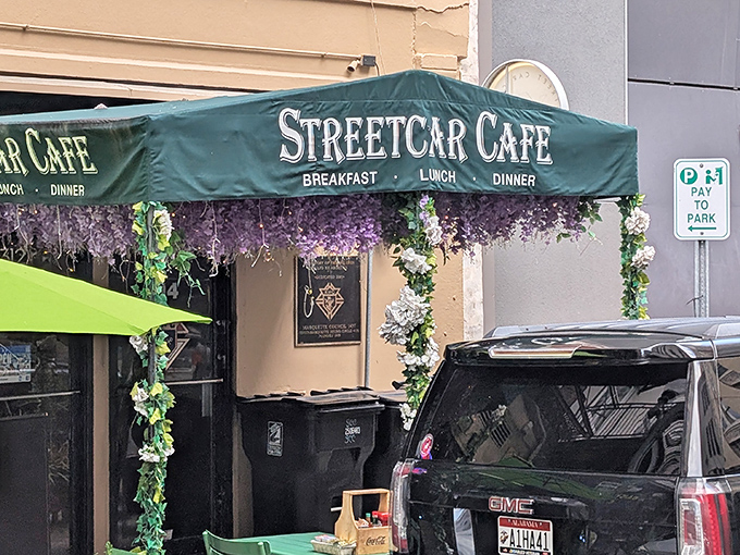 Purple paradise! Streetcar Caf&eacute;'s wisteria-draped entrance promises breakfast magic that lives up to its flowery first impression.