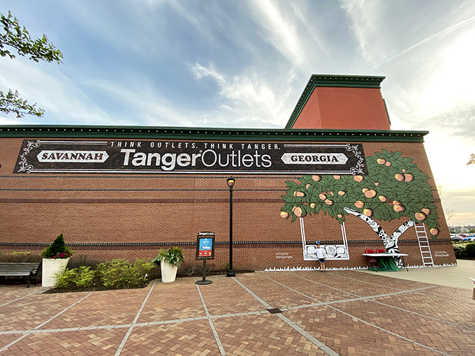 The brick facade of Tanger Outlets Savannah welcomes bargain hunters like an old friend with deep pockets and generous discounts.