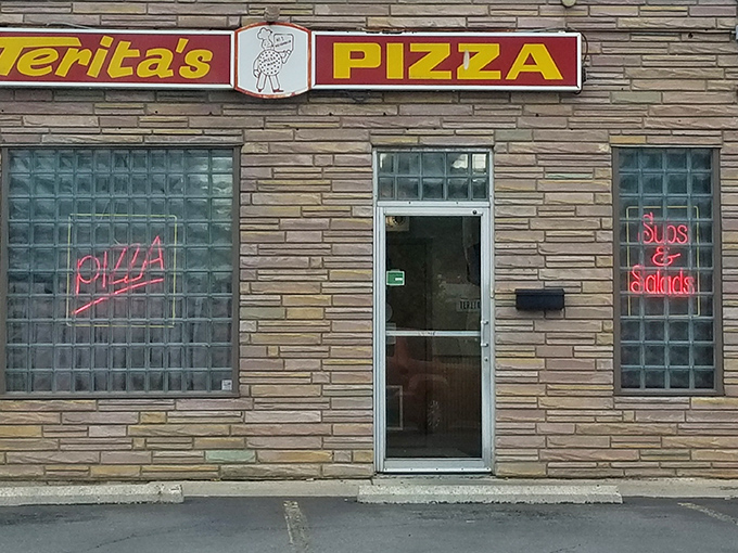 Terita's Pizza: The stone facade and vintage sign scream "we've been making perfect pizza since before fancy toppings were invented!"