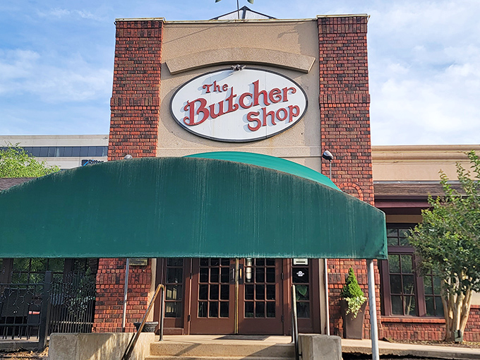 The Butcher Shop's brick facade and green awning &ndash; like a meaty welcome mat for carnivores seeking their happy place.