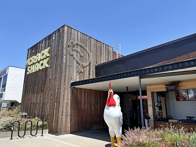 The Crack Shack's rustic wooden exterior and giant chicken statue &ndash; a clucking good welcome to fried chicken paradise!