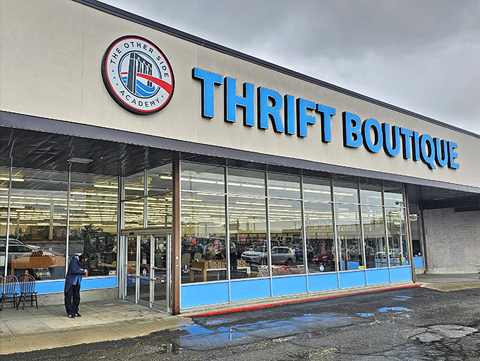 The bright blue sign of The Other Side Thrift Boutique promises treasures inside – like finding Narnia in a shopping mall!