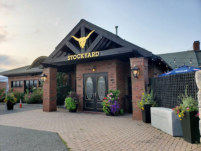 The Stockyard's iconic yellow bull sign welcomes meat lovers like a beacon of beefy hope. Brick, flowers, and prime cuts await!