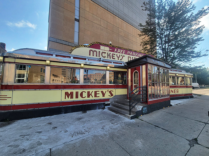 The gleaming yellow and red exterior of Mickey's Diner stands like a time capsule in downtown St. Paul, beckoning hungry travelers since the Roosevelt administration.