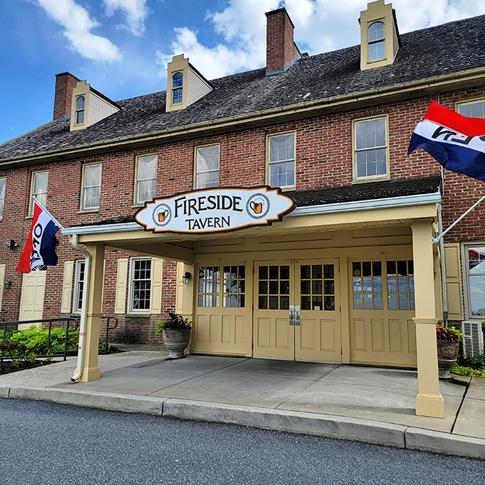 Colonial charm meets culinary excellence at Fireside Tavern's distinctive brick exterior. Those dormer windows have witnessed generations of satisfied diners coming through those cream-colored doors.