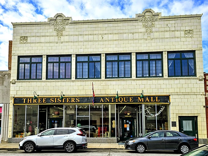 The historic façade of Three Sisters Antique Mall beckons with promises of vintage treasures behind those gleaming windows.