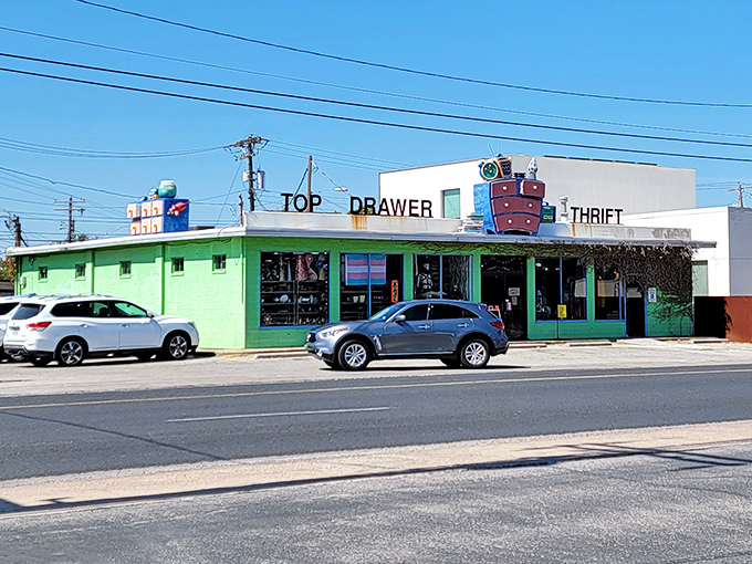 That bright green building practically winks at you from Airport Boulevard, promising treasures inside.