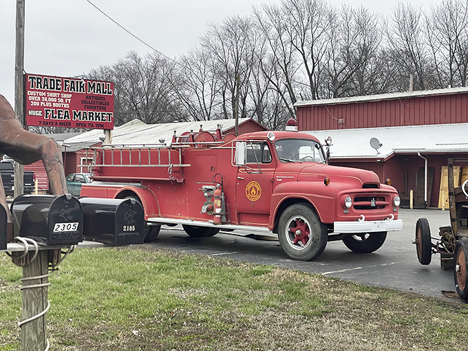 A vintage fire truck stands guard outside Trade Fair Mall, like a red-painted time machine ready to transport treasure hunters to the past.