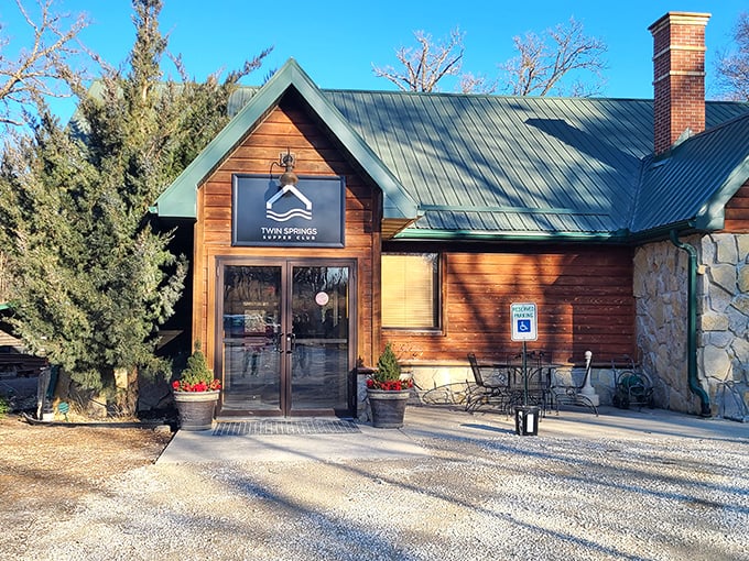 Twin Springs' rustic log cabin exterior looks like it belongs in a Hallmark movie about finding love in the countryside.