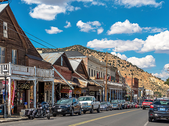 Virginia City's main street looks like you've stepped onto a Western movie set, complete with wooden sidewalks and historic storefronts against a mountain backdrop.