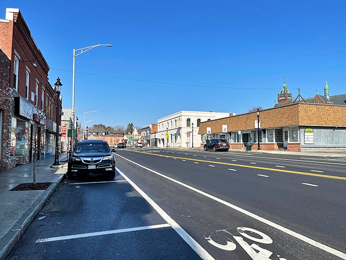 Main Street magic! Ware's wide lanes and brick storefronts whisper tales of small-town thrift, where $1,200 stretches like saltwater taffy on a summer day.
