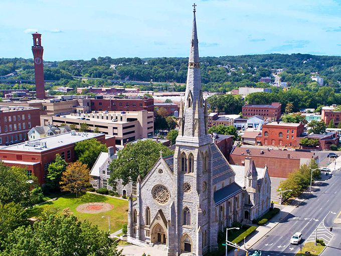 Waterbury's stunning church spire reaches skyward like a prayer in stone, anchoring this historic downtown with timeless grace.