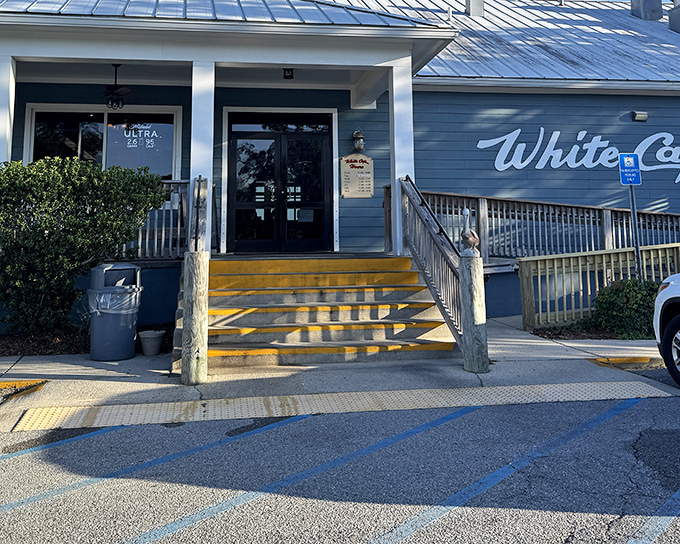That blue and white facade whispers "fresh seafood inside" louder than a dinner bell at sunset.