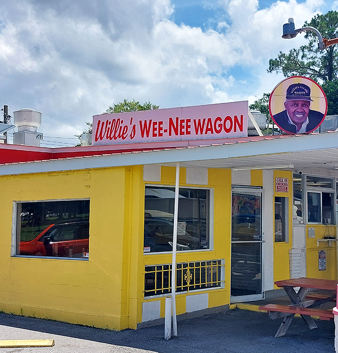 That cheerful yellow facade practically shouts "happiness served here" - Willie's knows presentation matters as much as taste.