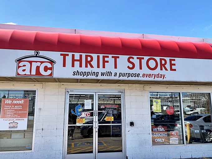 The iconic red awning of arc Thrift Store beckons bargain hunters like a lighthouse for the budget-conscious shopper.