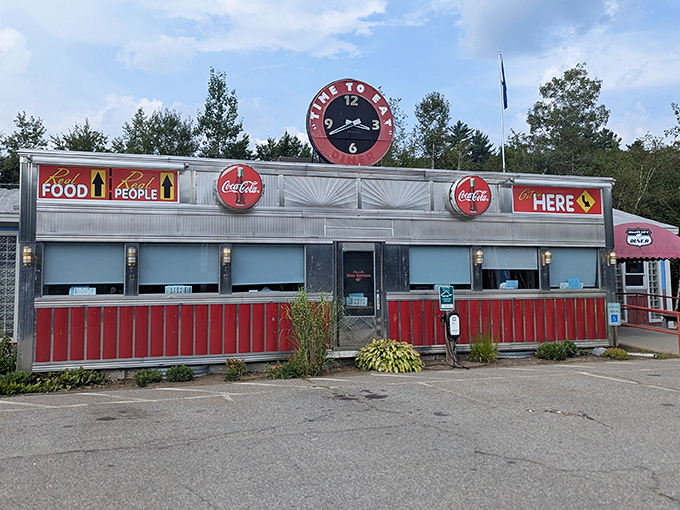 "Food People Here" isn't just a sign—it's a promise. This retro diner's shiny exterior is like a time machine with home fries.