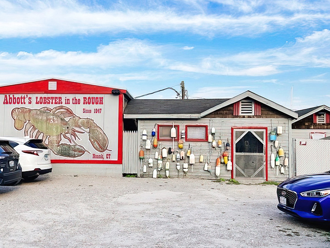 The weathered sign says it all: "Lobster in the Rough" since 1947. No pretense, just seafood perfection waiting inside.