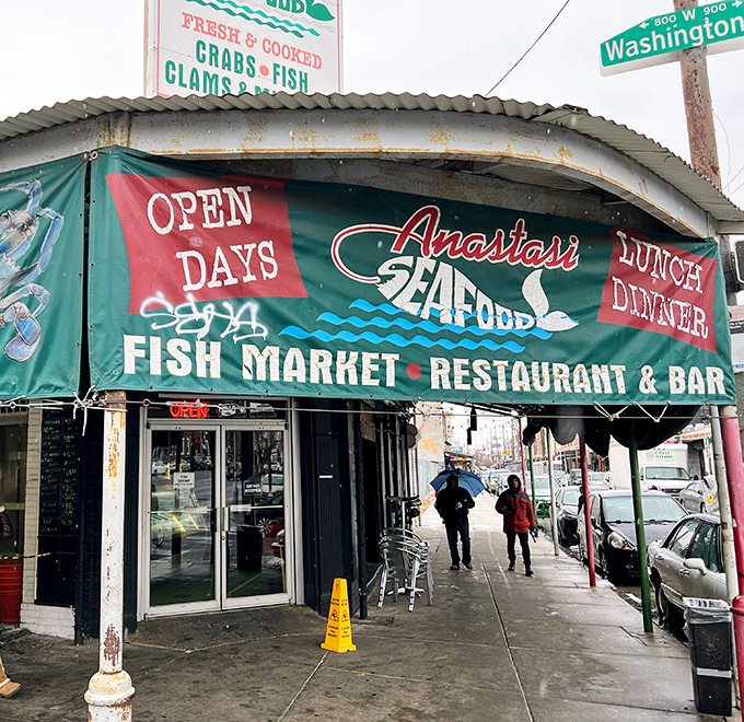 Fresh seafood meets neighborhood charm where green awnings promise oceanic delights just steps away.