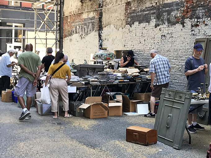 Books scattered like fallen leaves - every bibliophile's dream come true in concrete paradise.