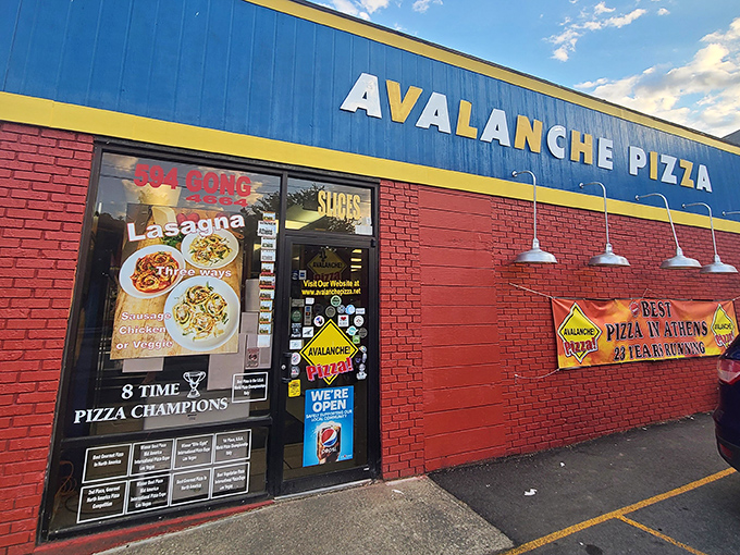 That bright blue and yellow storefront isn't shy about announcing pizza greatness awaits inside.