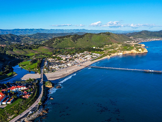 The pier stretches into calm bay waters where even nervous swimmers feel brave enough to dive in.