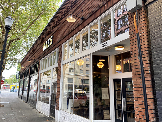 BAES's glowing sign against brick promises fried chicken nirvana in downtown Portland. Simple, stylish, and about to change your chicken standards forever.