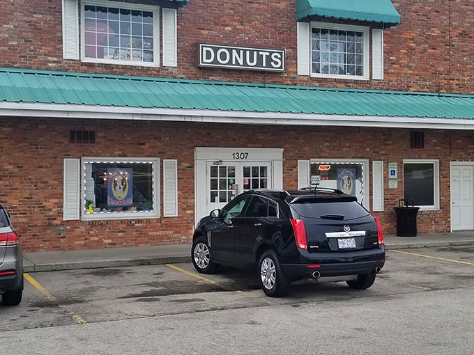 That classic "DONUTS" sign says it all &ndash; no fancy frills needed when the goods inside are this delicious.