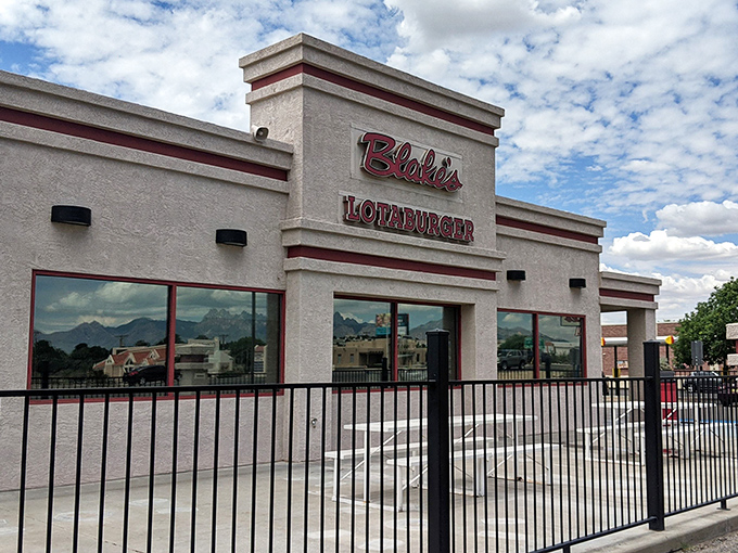 The classic red and gray exterior of Blake's Lotaburger promises New Mexico's favorite green chile burger awaits inside.