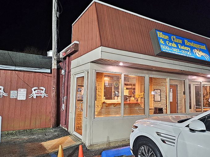 Night falls, but crab fever rises! The warm glow from Blue Claw's windows beckons seafood lovers like moths to a buttery, garlic-scented flame.