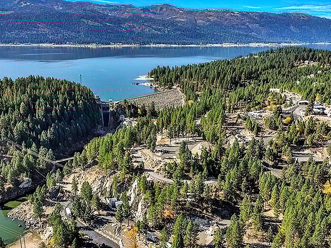 Nature's masterpiece on display! The dam at Lake Cascade creates a stunning contrast between the deep blue waters and emerald forests.