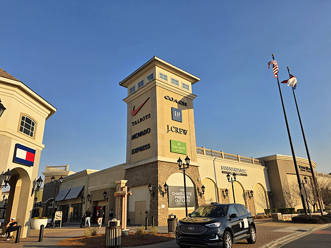 Like a shopping mall prom queen, Charlotte Premium Outlets dresses up discount shopping with designer flair.