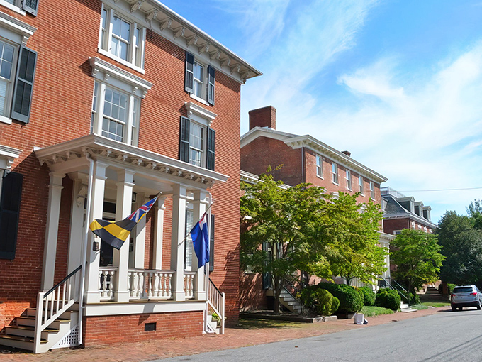Maryland flags flutter proudly against brick facades in Chestertown, where history isn't just preserved&mdash;it's celebrated daily.
