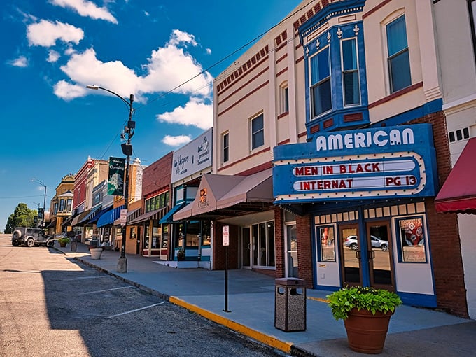 Classic American downtown where the movie theater marquee still announces community gatherings and Friday night films.