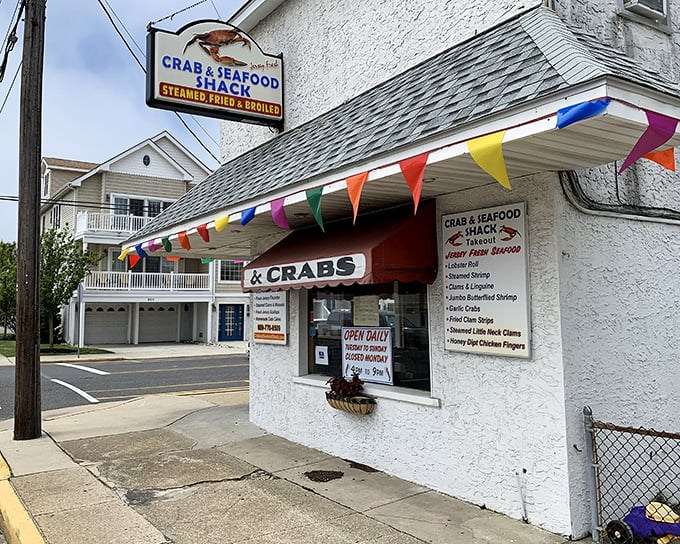 Sometimes the best seafood shacks look like they were painted by someone who truly loves both the ocean and having a good time.