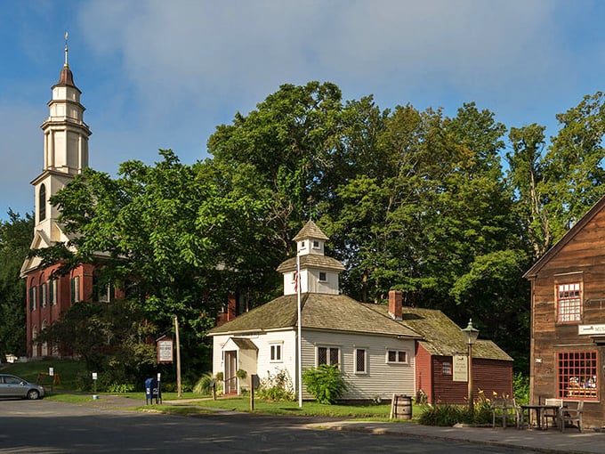 Historic buildings cluster together like old friends sharing centuries of stories in this perfectly preserved Massachusetts village.