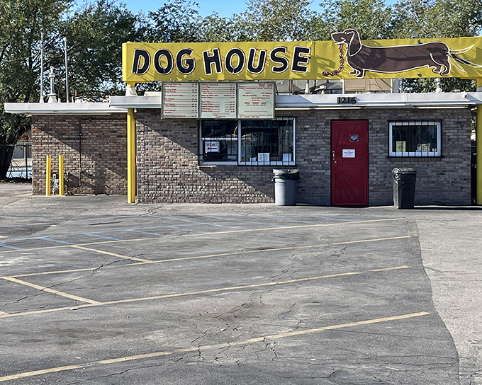 That cheerful yellow awning and giant dachshund banner practically wave you down like an old friend calling your name.