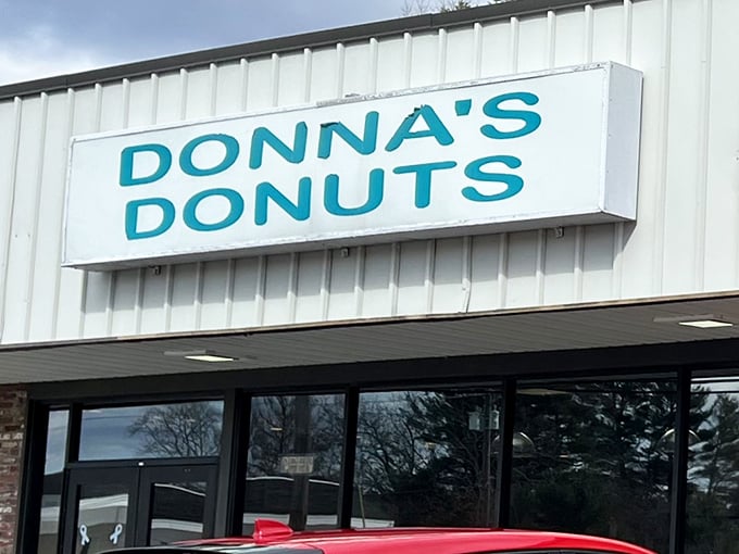 The simple charm of Donna's Donuts sign against the New England sky &ndash; where donut dreams come true without unnecessary fuss.